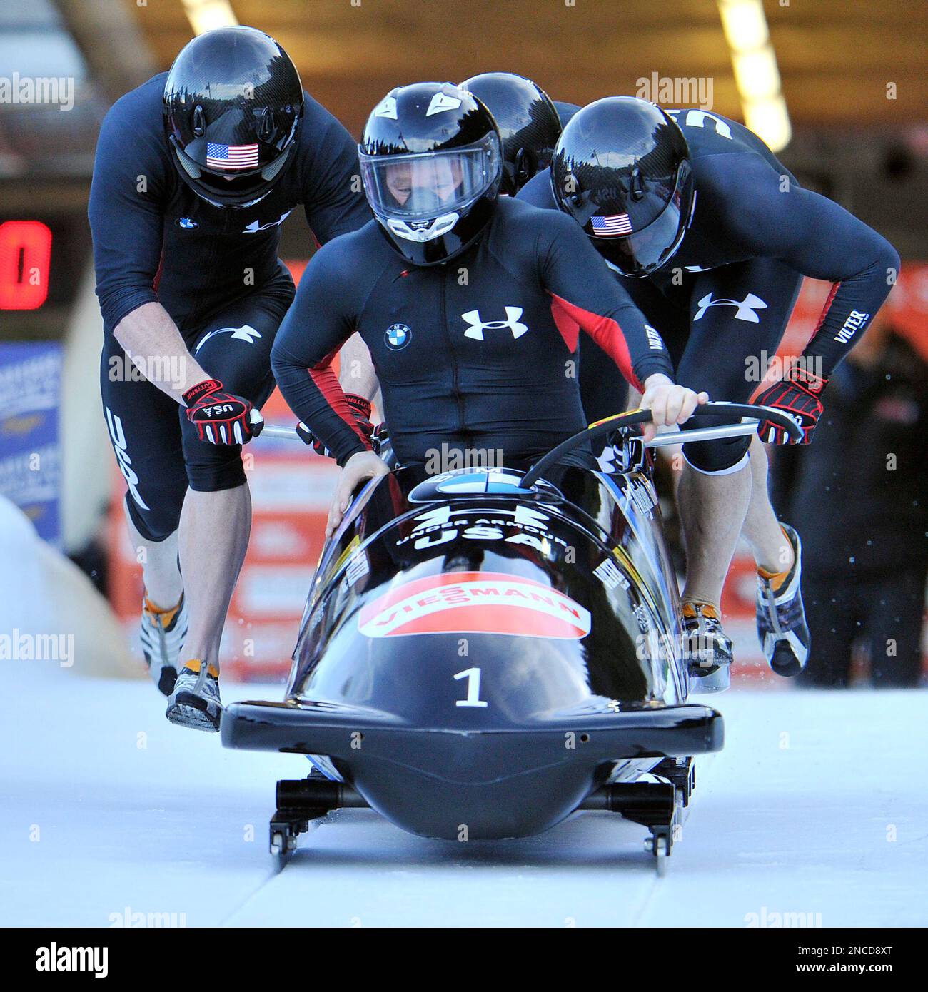 Pilot Steven Holcomb, center, Justin Olsen, right, Steven Langton, left ...
