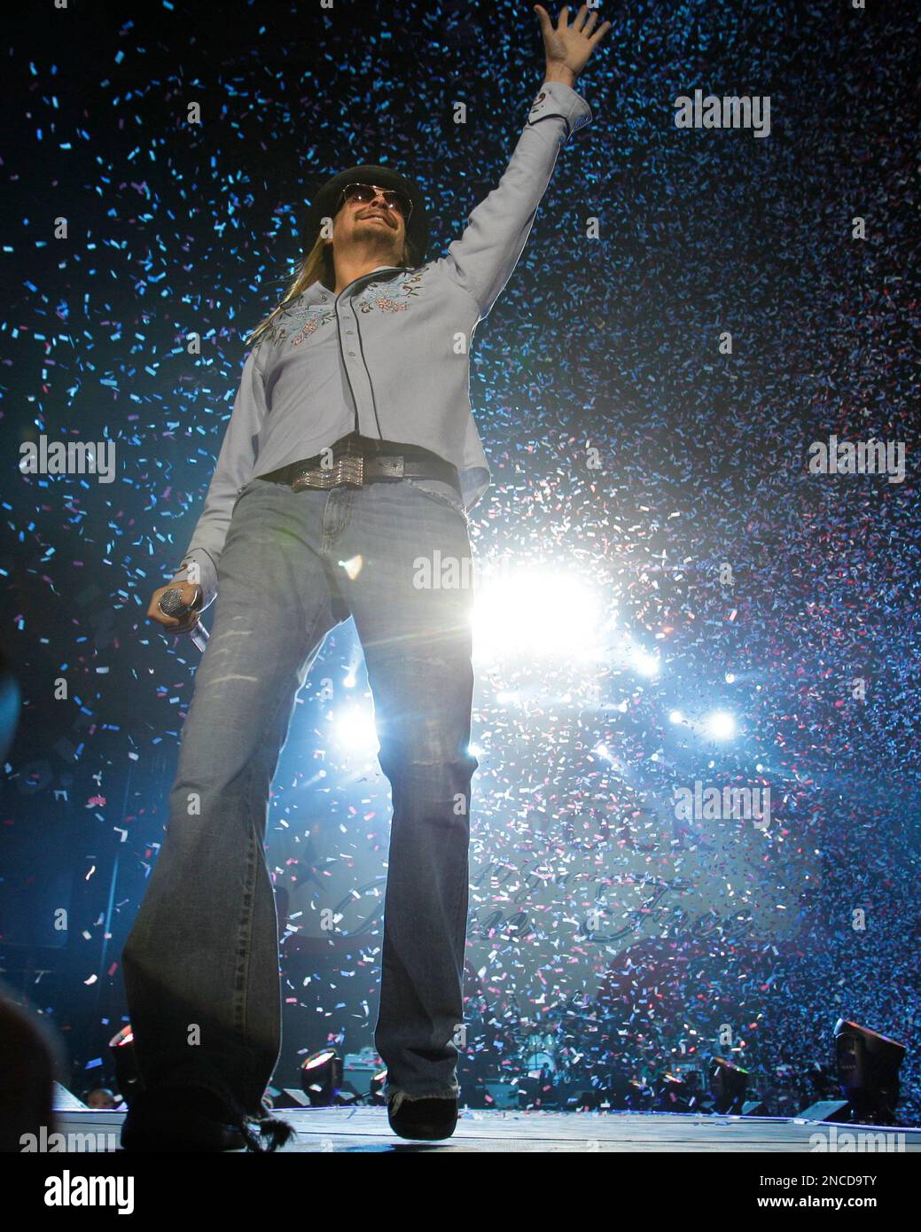 Kid Rock walks out on the stage to start his concert at Ford Field in ...