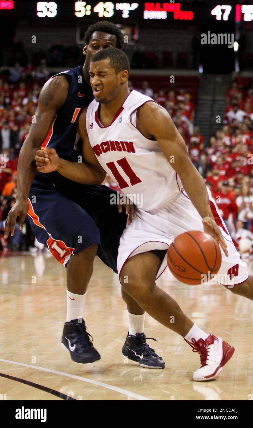 Wisconsin Jordan Taylor (11) drives past Illinois' D.J. Richardson ...