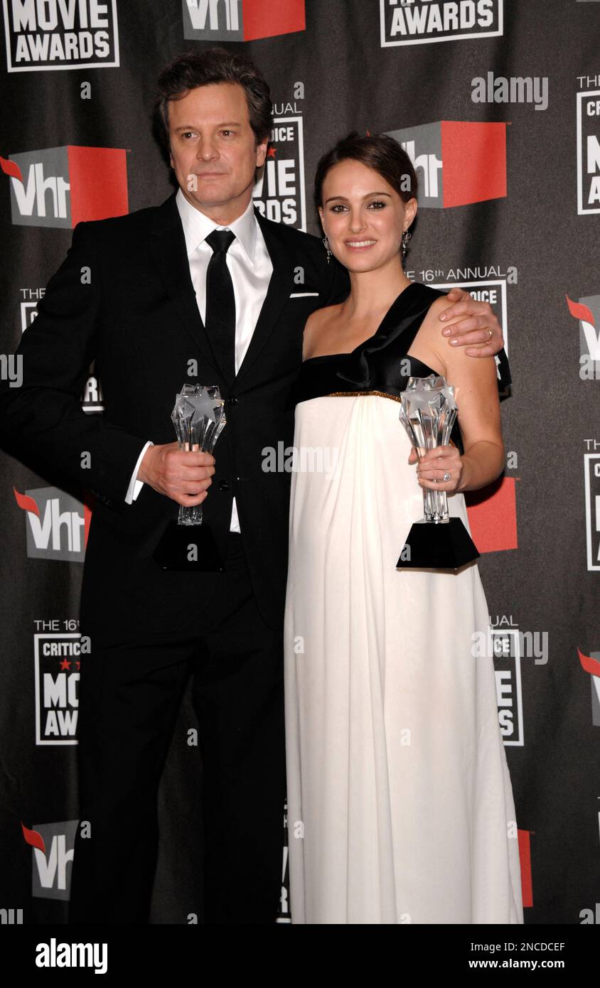 Actor Colin Firth, left, and actress Natalie Portman pose backstage ...