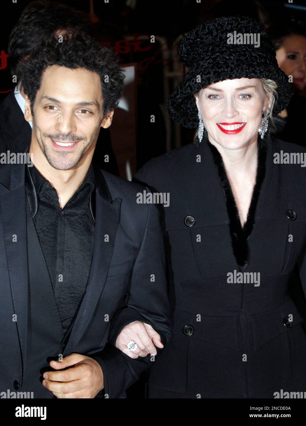 U.S. actress Sharon Stone, right, and French actor Tomer Sisley arrive ...