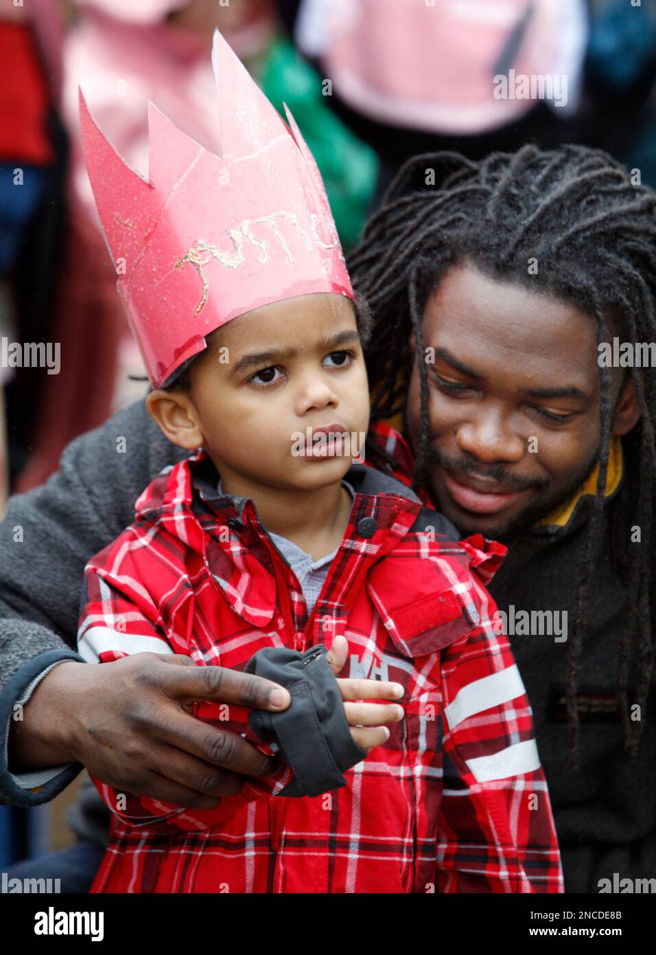 A.J. Brooks, right, helps show his son Peyton Brooks, 3, how to hold ...