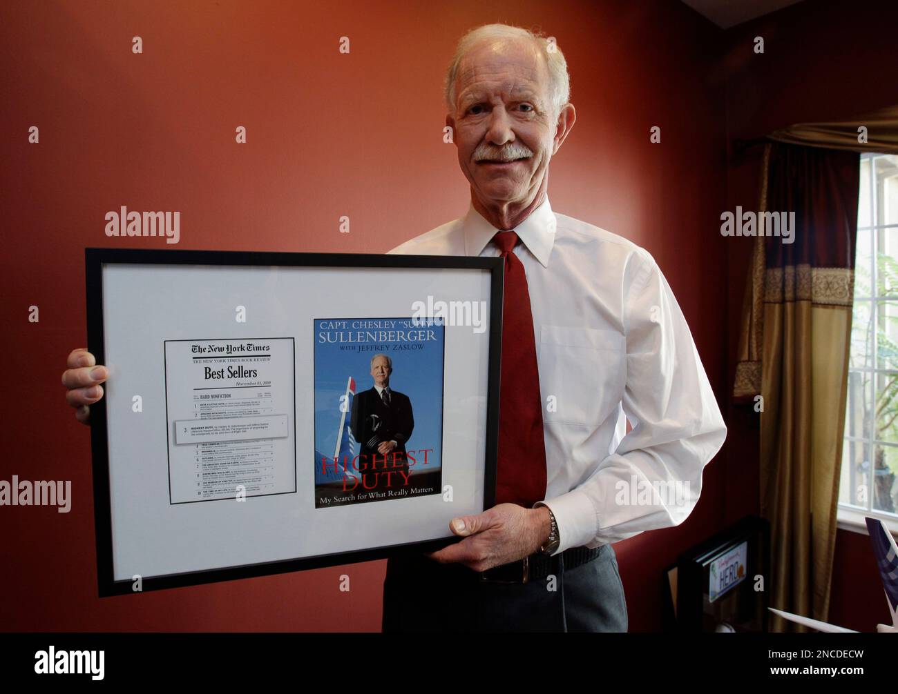 In this Jan. 10, 2011 photo. Capt. Chesley "Sully" Sullenberger holds ...