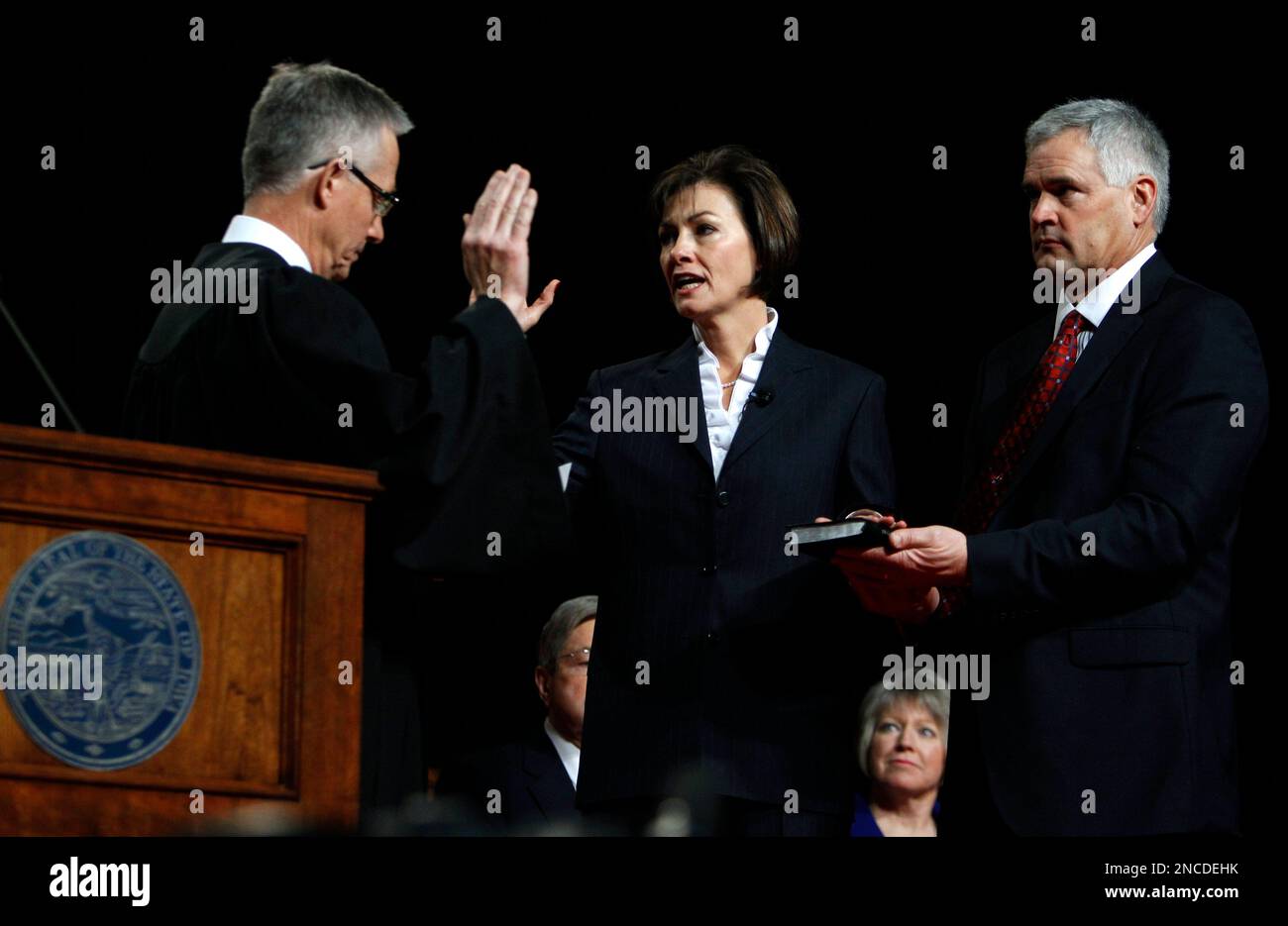 Iowa Supreme Court Chief Justice Mark Cady administers the oath of ...