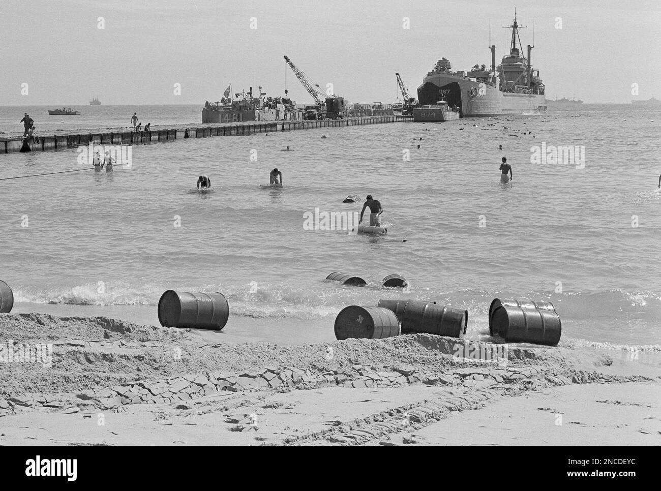 U.S. Seabees bring oil drums ashore at Chu Lai, 52 miles south of Da ...
