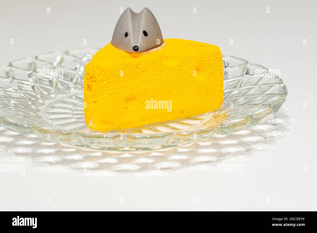 A single piece of cheesecake is shaped like a slice of a cheese wheel ...