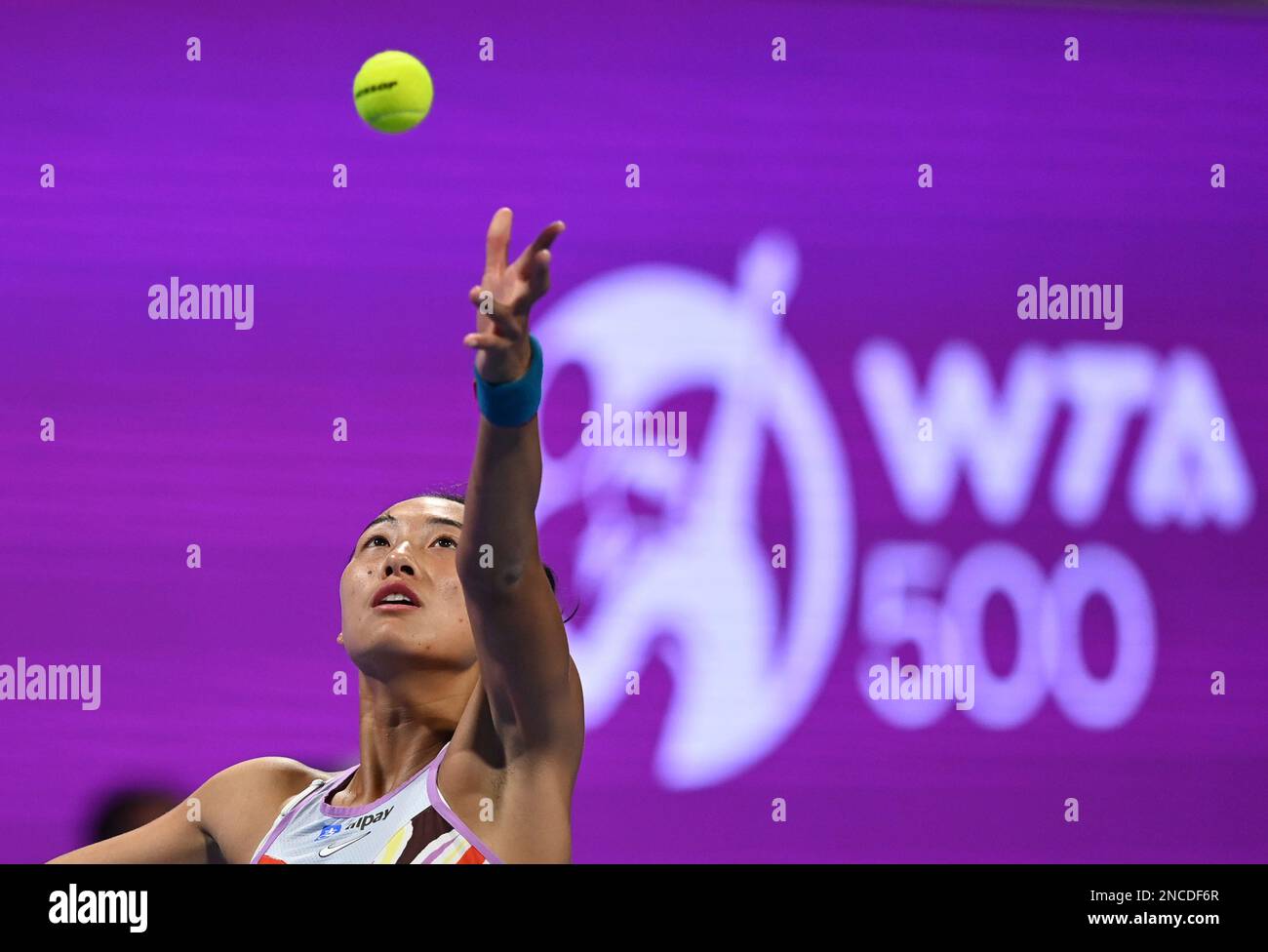 Doha, Qatar. 14th Feb, 2023. Zheng Qinwen of China serves during the singles round of 32 match ...
