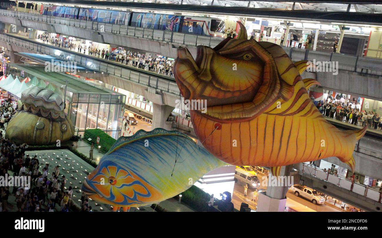 Giant fish balloons float into the air during a celebration at the Siam ...
