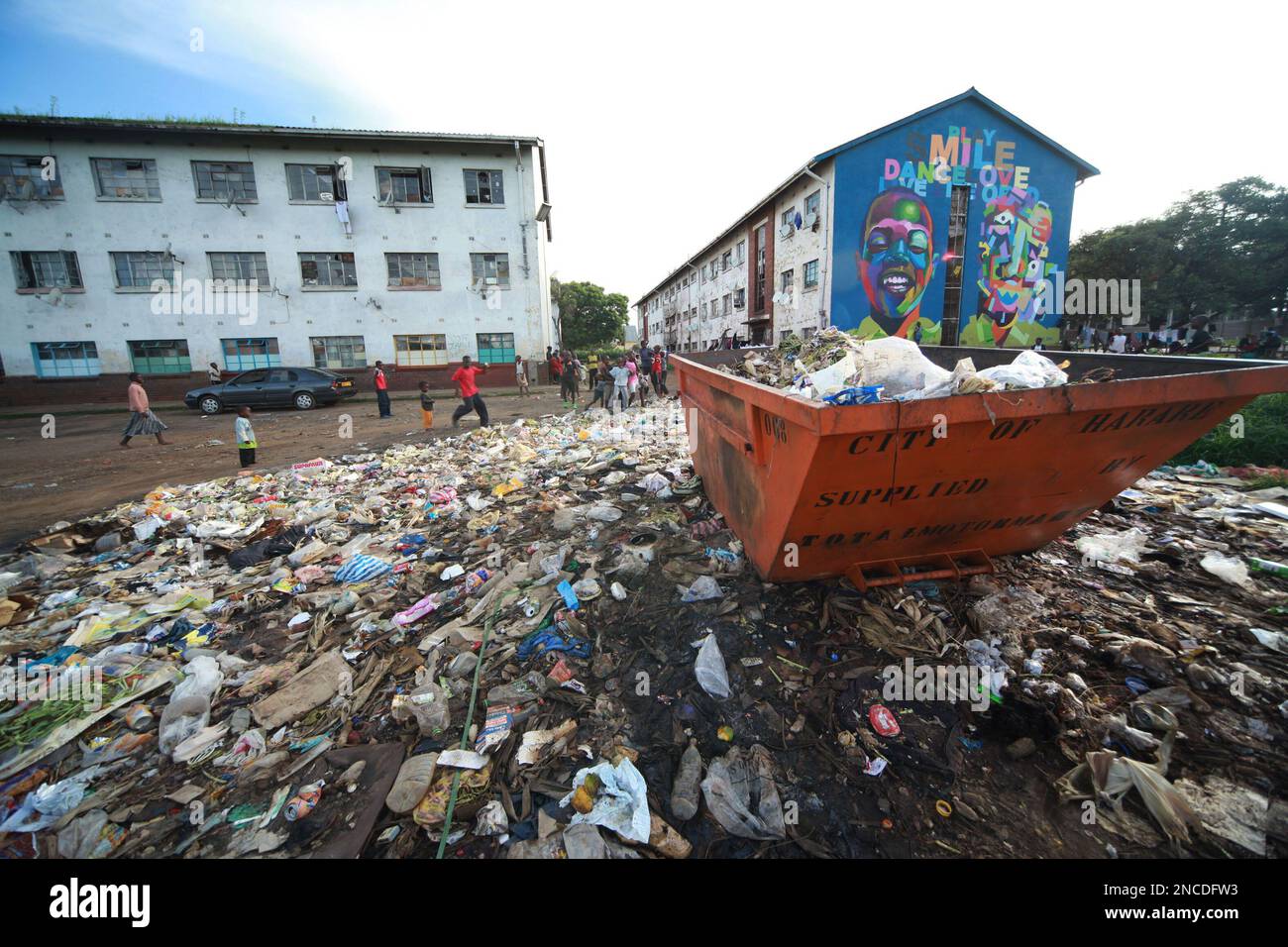 A rubbish bin lies uncollected in the High Density suburb of Mbare in ...