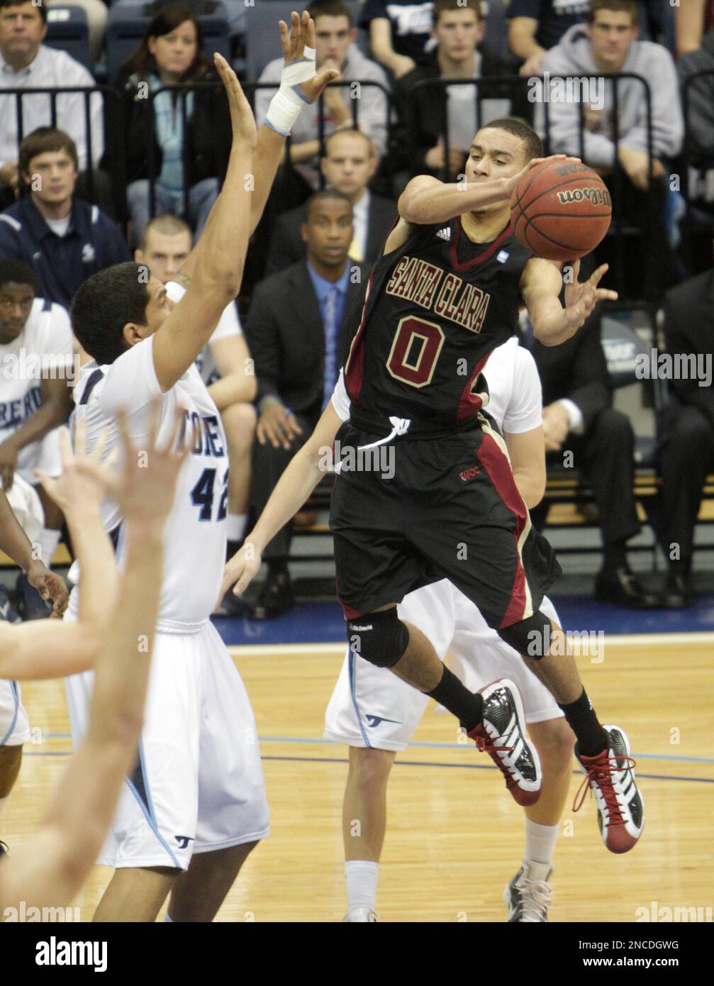Santa Clara's Evan Roquemore fires a pass around San Diego's Chris ...