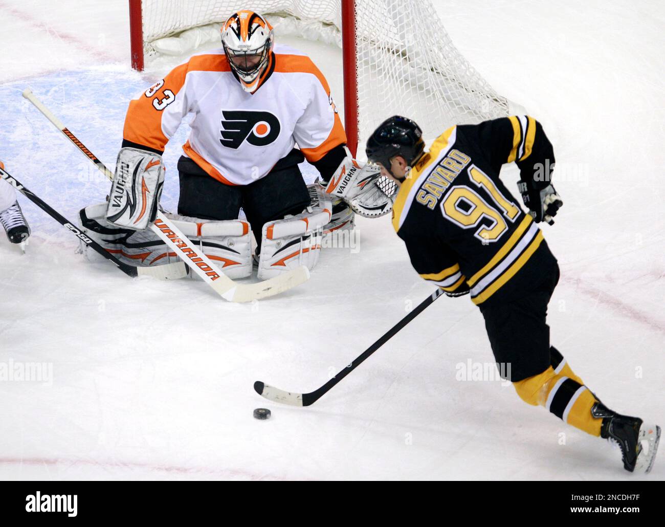 Philadelphia Flyers goalie Brian Boucher, left, drops to the ice to ...