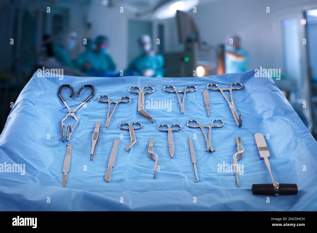 Different surgical instruments on table in operating room Stock Photo ...