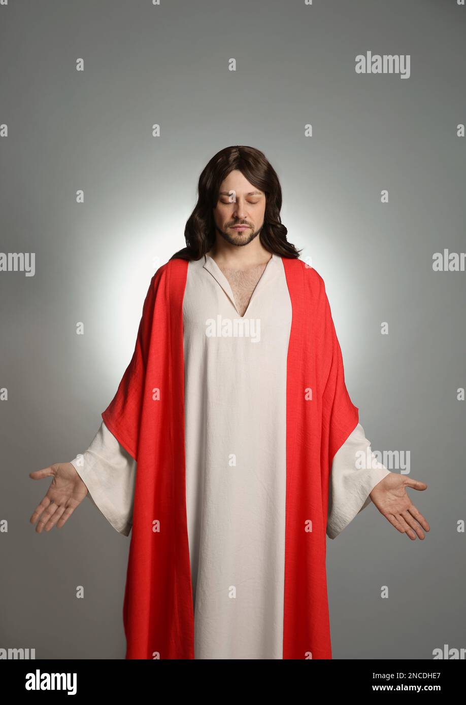 Jesus Christ with outstretched arms on light grey background Stock ...