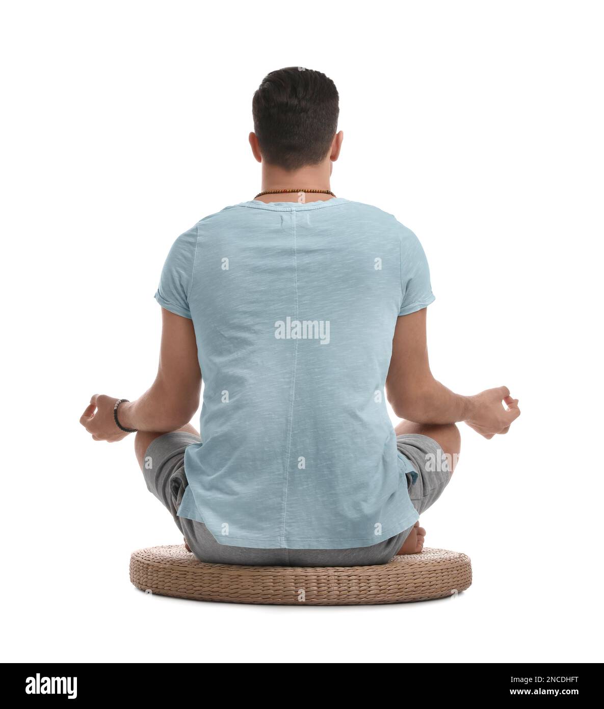 Man meditating on white background, back view Stock Photo - Alamy