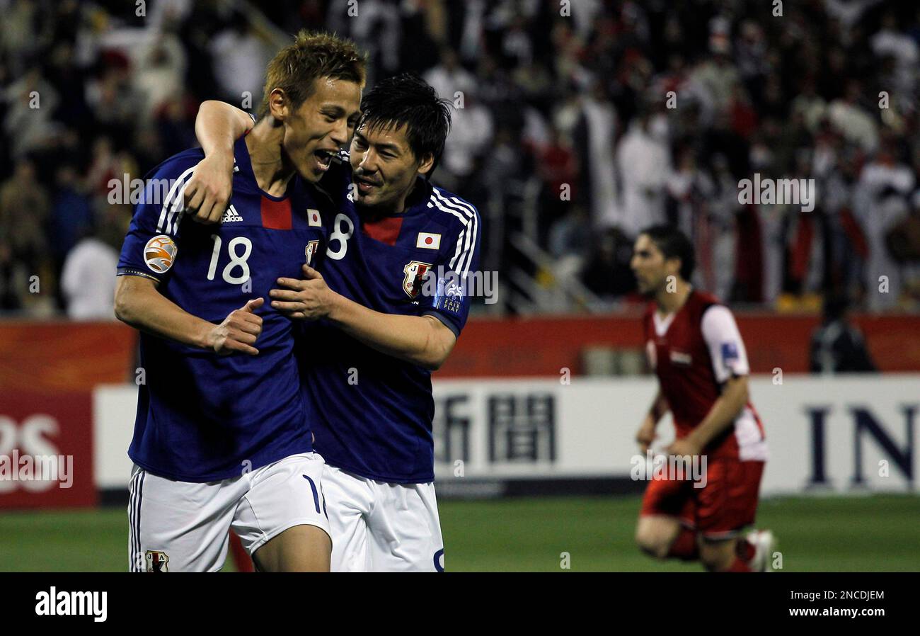 Japan's player Keisuke Honda, left, and Japan's player Daisuke Matsui ...