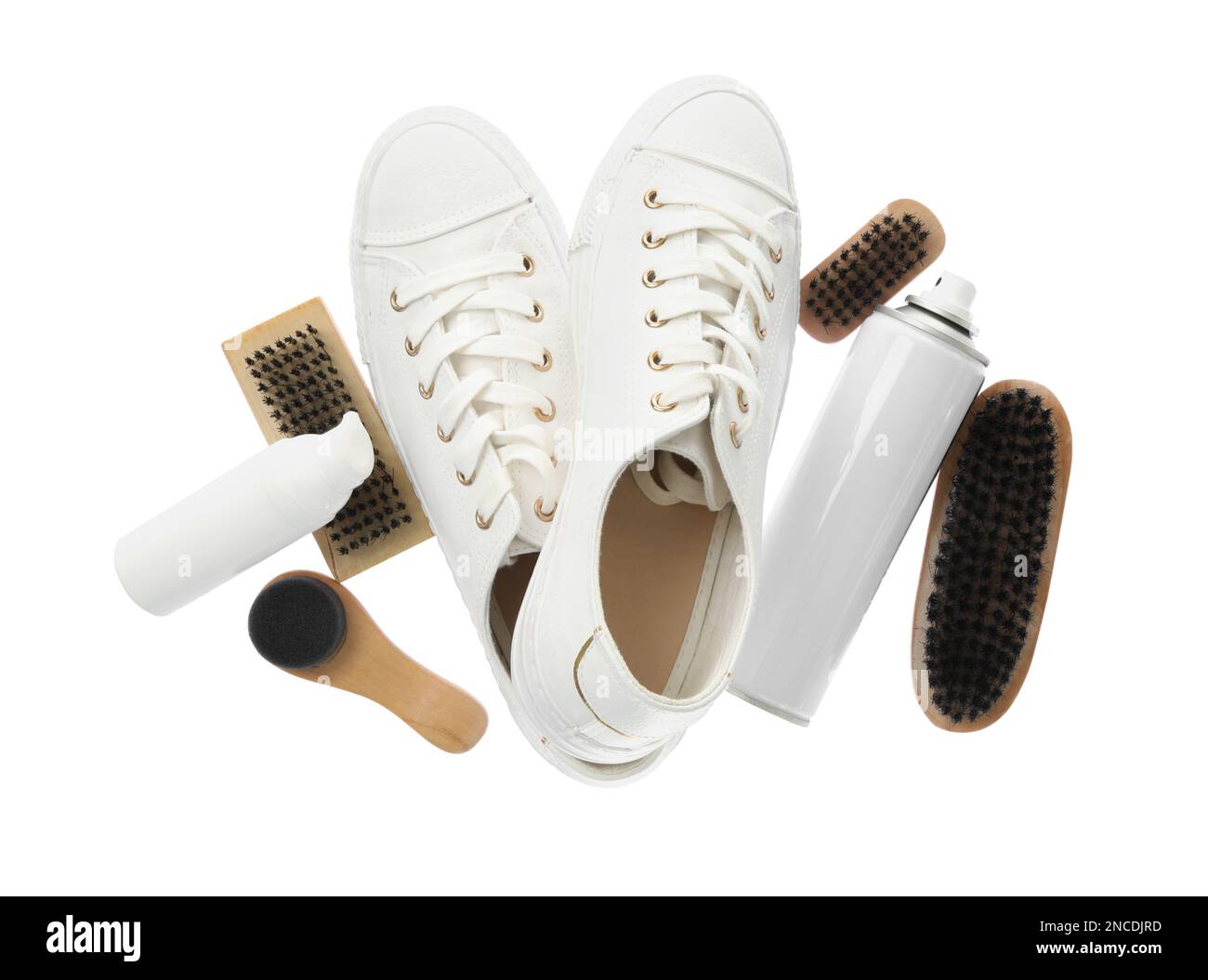 Composition with stylish footwear and shoe care accessories on white ...
