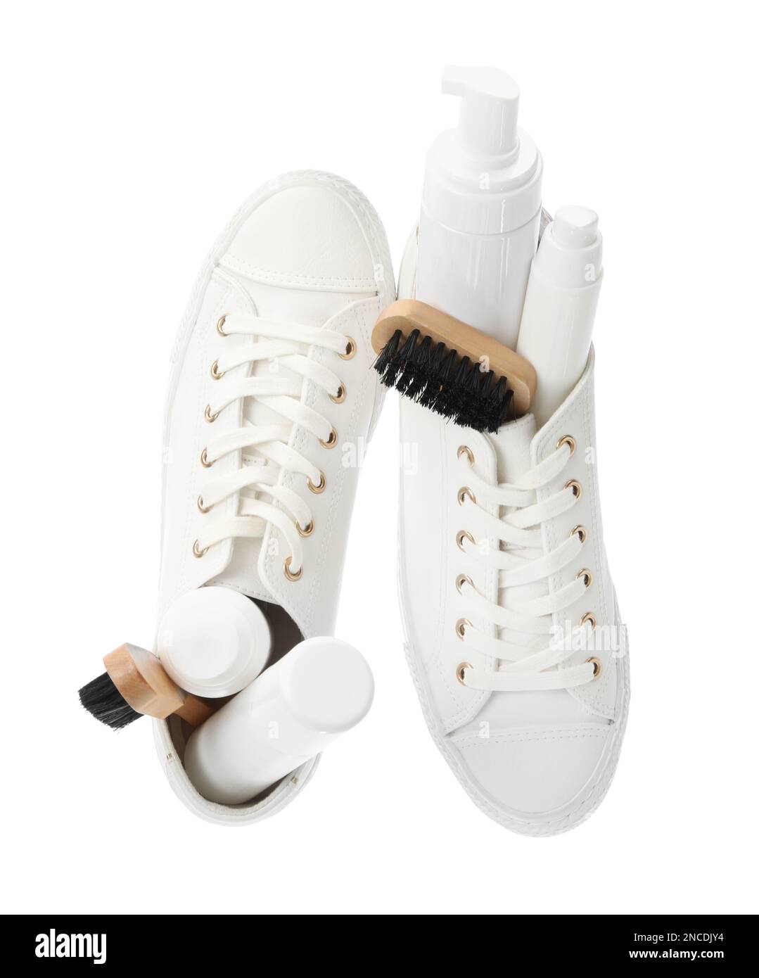 Stylish footwear with shoe care accessories on white background, top ...
