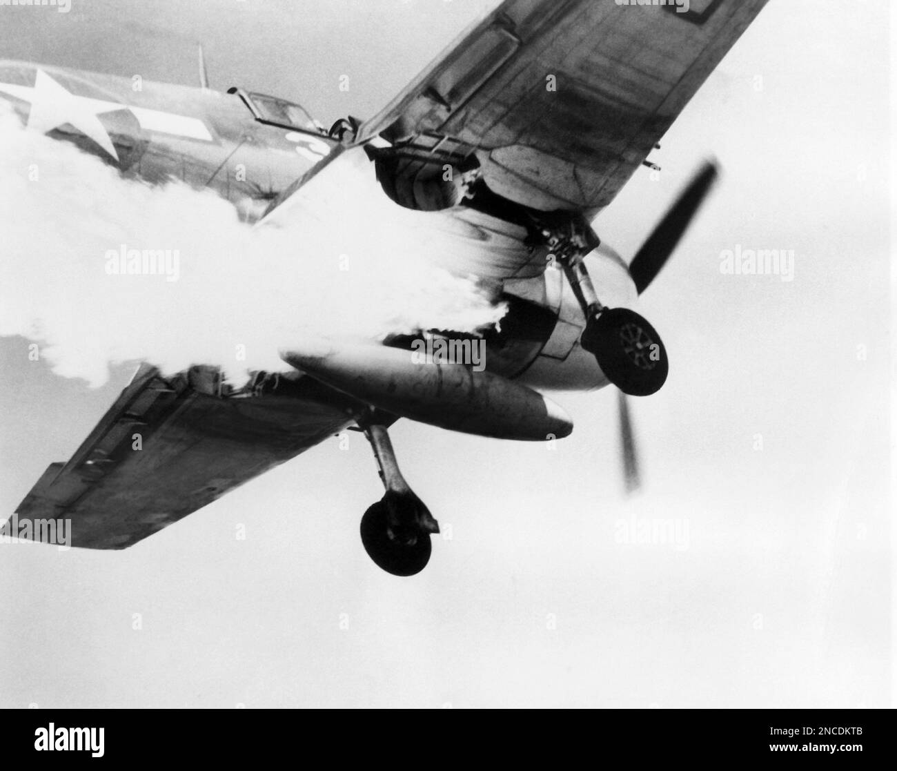 This flaming Navy Grumman Hellcat plane strives for a landing on its ...