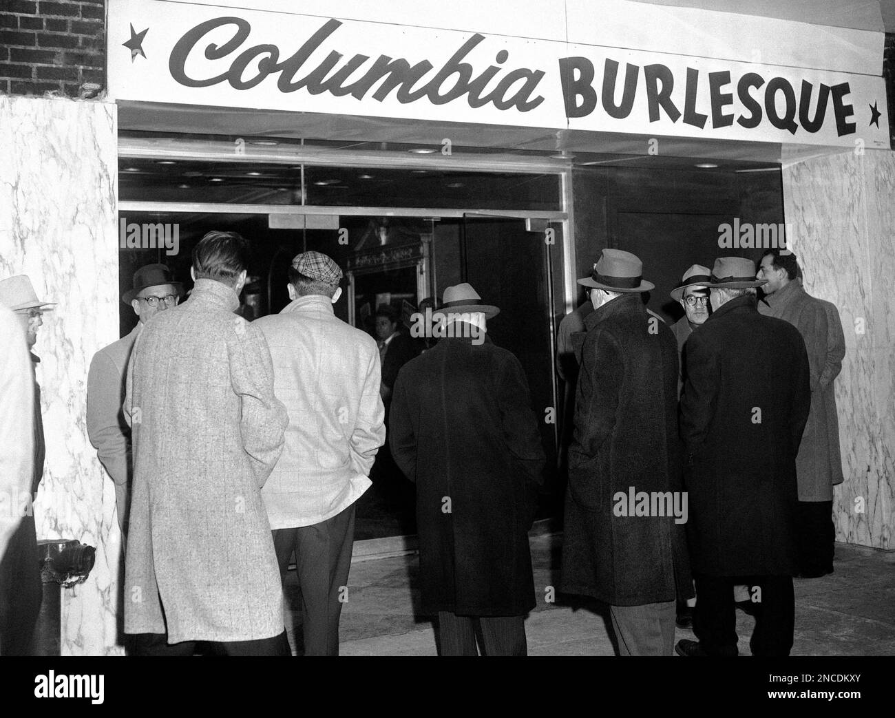 Patrons enter Columbia Burlesque Theatre at 2nd Ave., and 4th. St., as ...