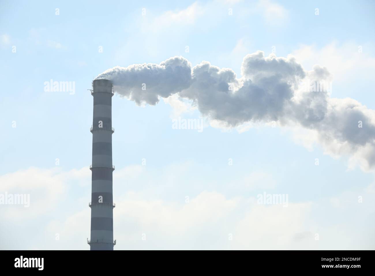 Polluting air with smoke from industrial chimney outdoors. CO2 ...