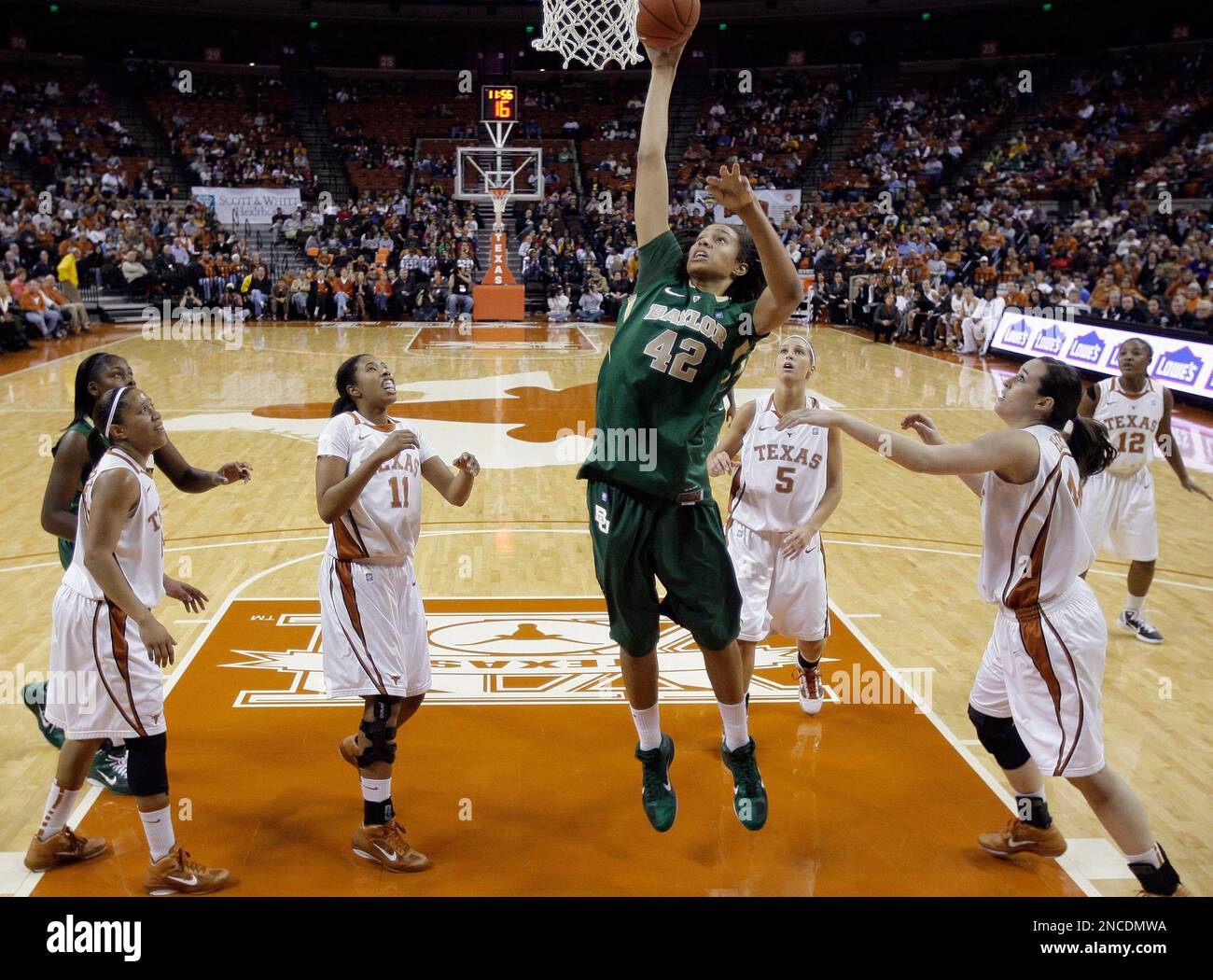 Baylor's Brittney Griner (42) scores as Texas defenders, from left ...