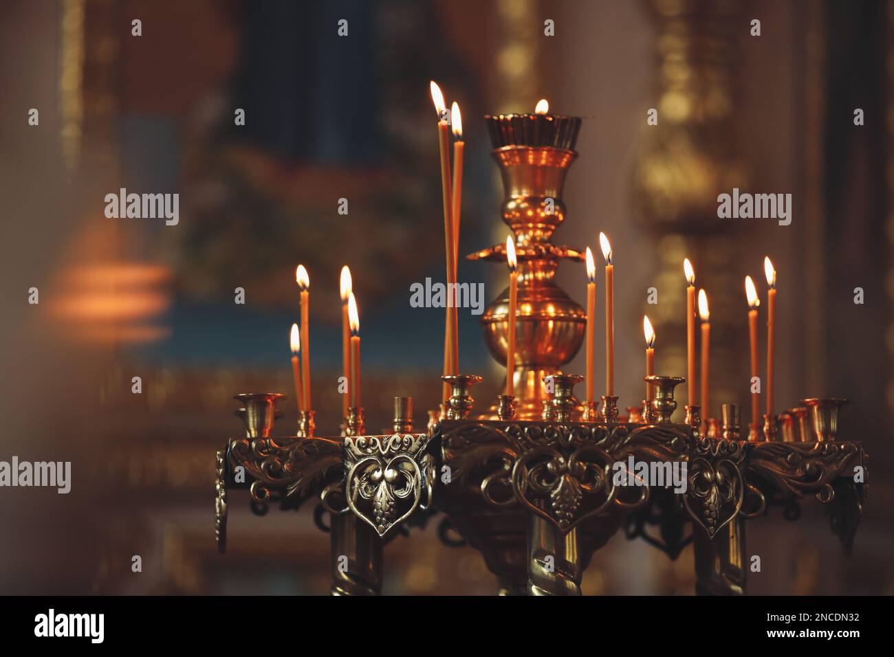 Beautiful stand with burning candles in church. Baptism ceremony Stock ...