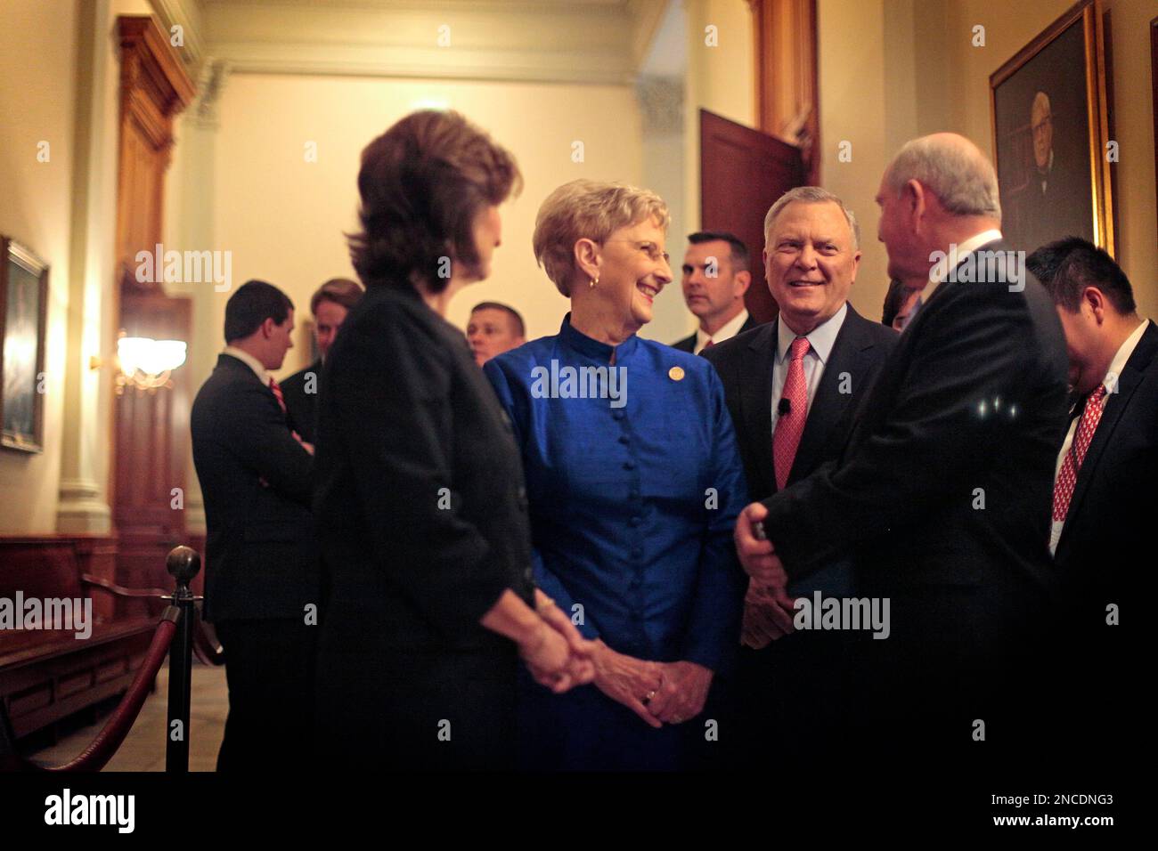 Outgoing Georgia Gov. Sonny Perdue, right, stands with from left wife ...