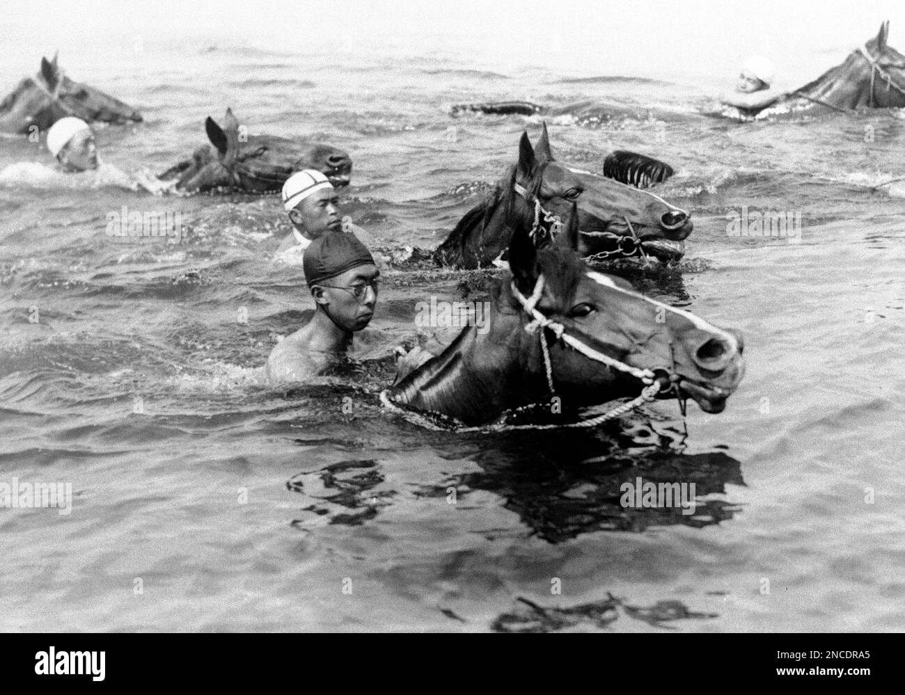 Prince Mikasa, in foreground wearing black skull cap, youngest of the ...