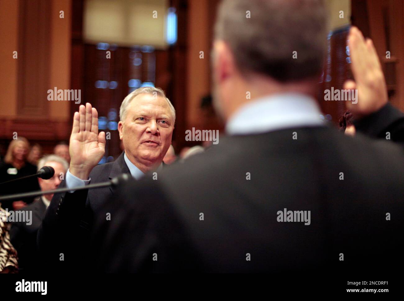 Georgia Gov. Nathan Deal, left, is sworn in by his son Hall County ...