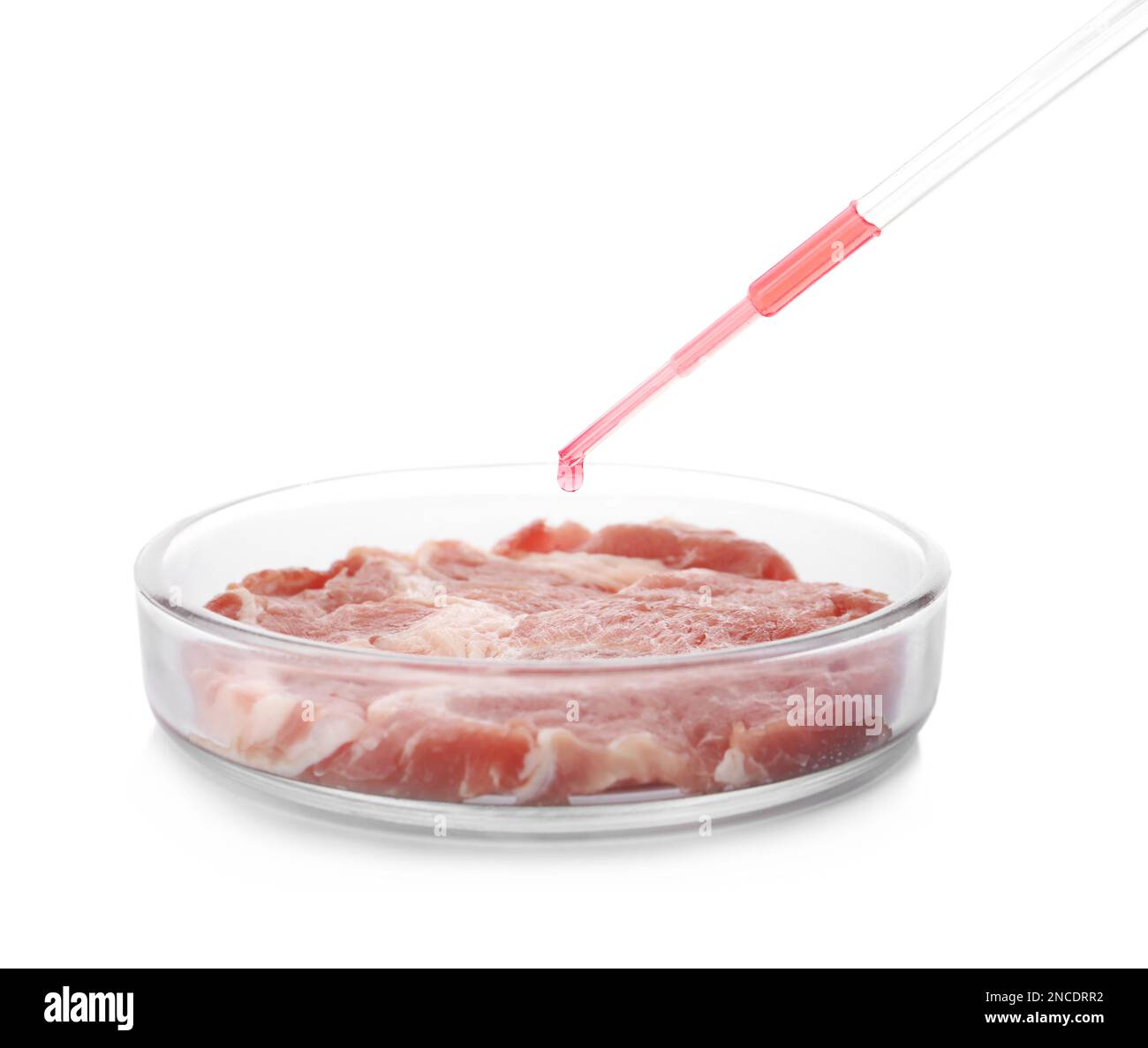 Dripping sample onto piece of raw cultured meat on white background ...