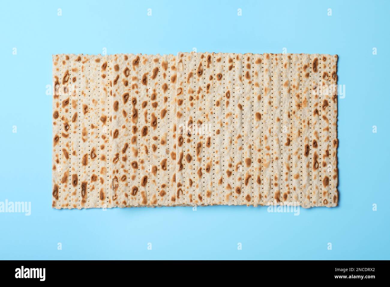 Traditional matzos on light blue background, top view Stock Photo - Alamy