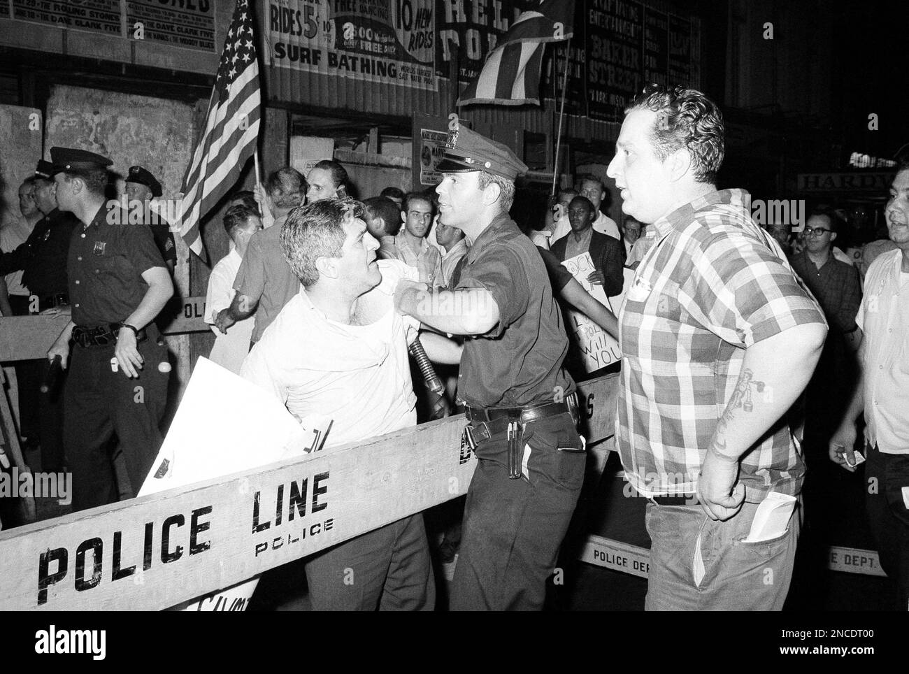 New York City policeman grabs demonstrator in scuffle between police ...