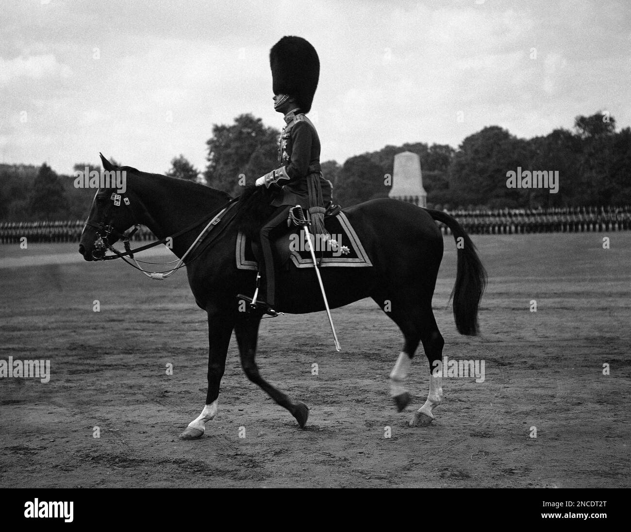 Britain's King George VI passing down the ranks of soldiers during the ...