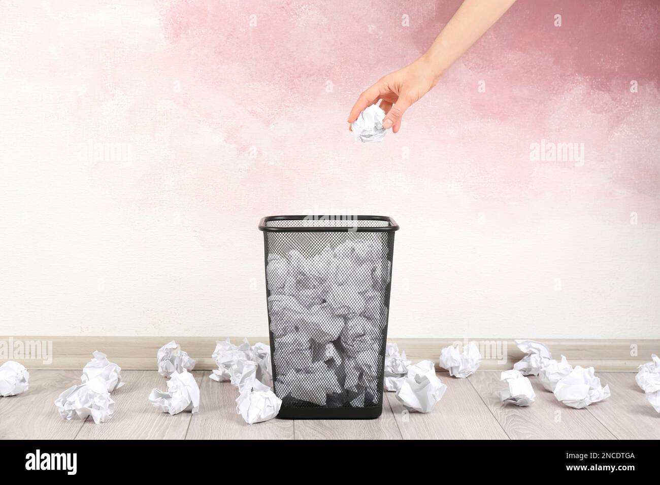 Woman throwing crumpled paper hi-res stock photography and images - Alamy