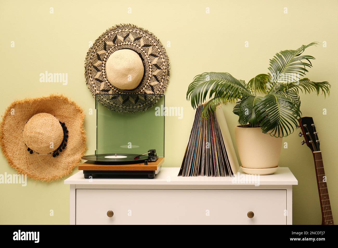 Stylish room interior with turntable and collection of vinyl records ...