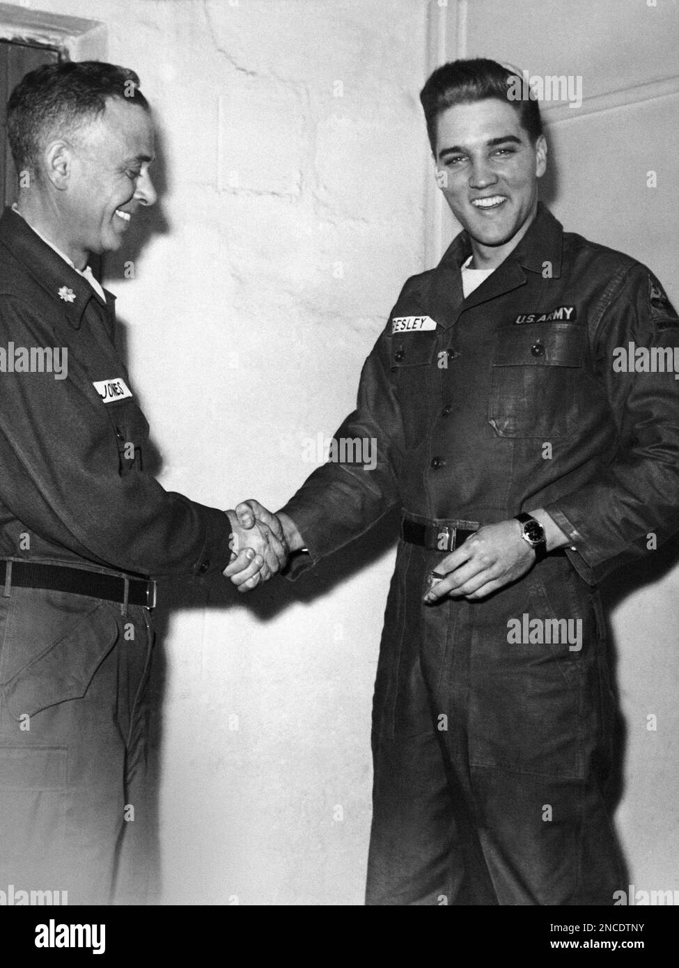 Orders for his promotion to sergeant brought on a handshake for US Rock ...
