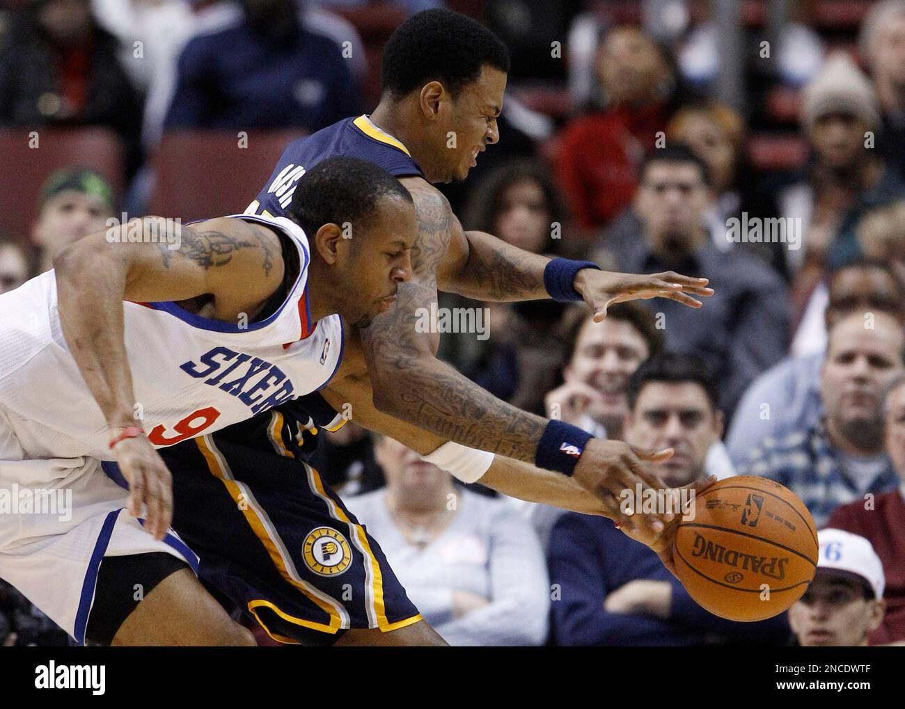 Philadelphia 76ers' Andre Iguodala, left, steals the ball from Indiana ...