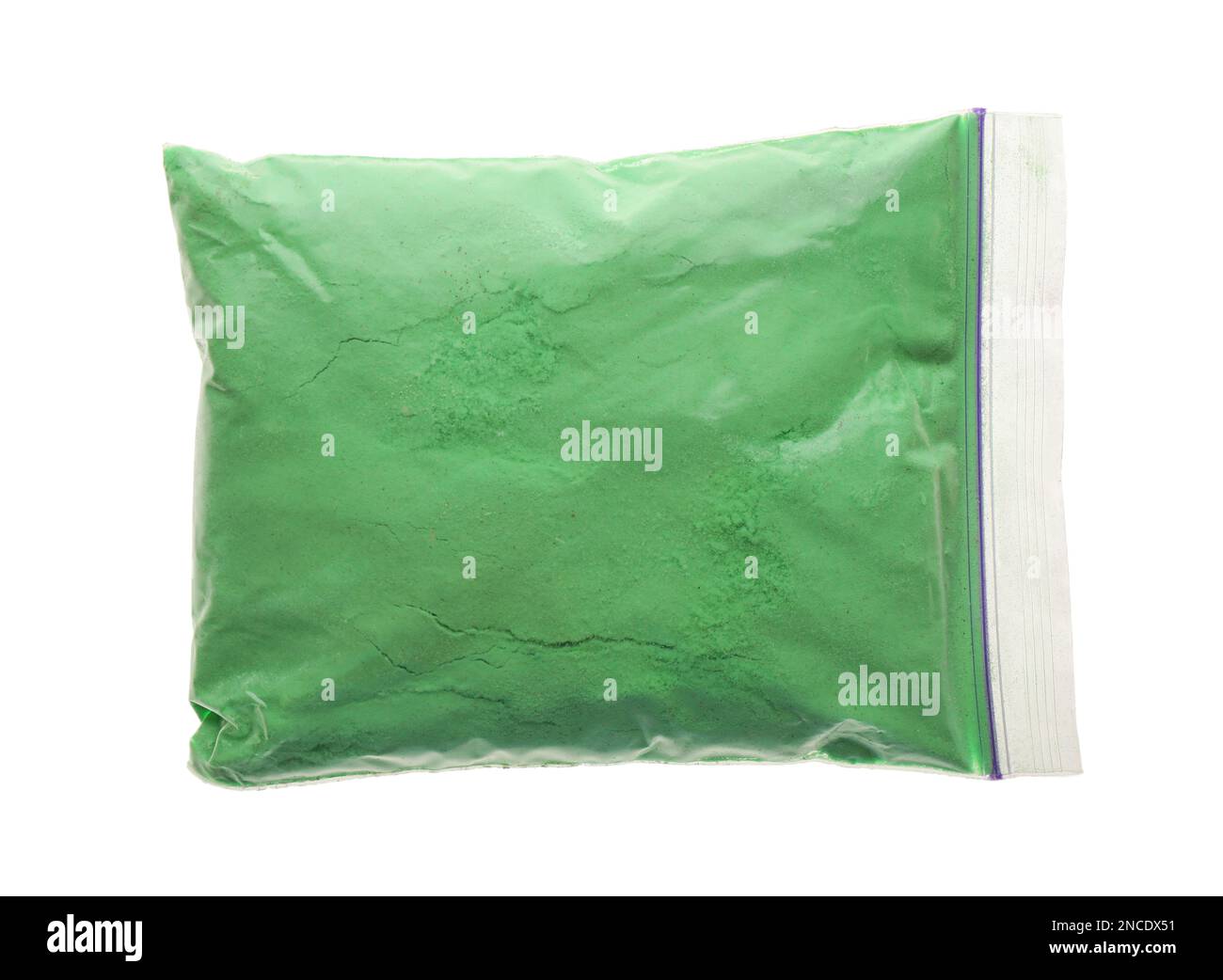 Green powder in plastic bag isolated on white, top view. Holi festival ...