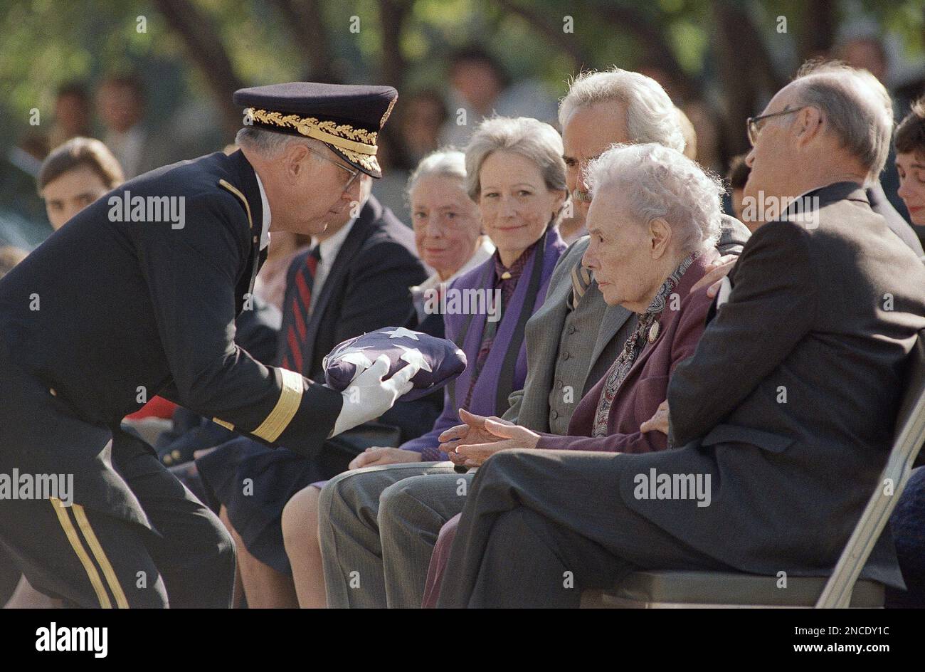 Adjutant General of Kansas Phil Finley presents the U.S. flag to Theo ...
