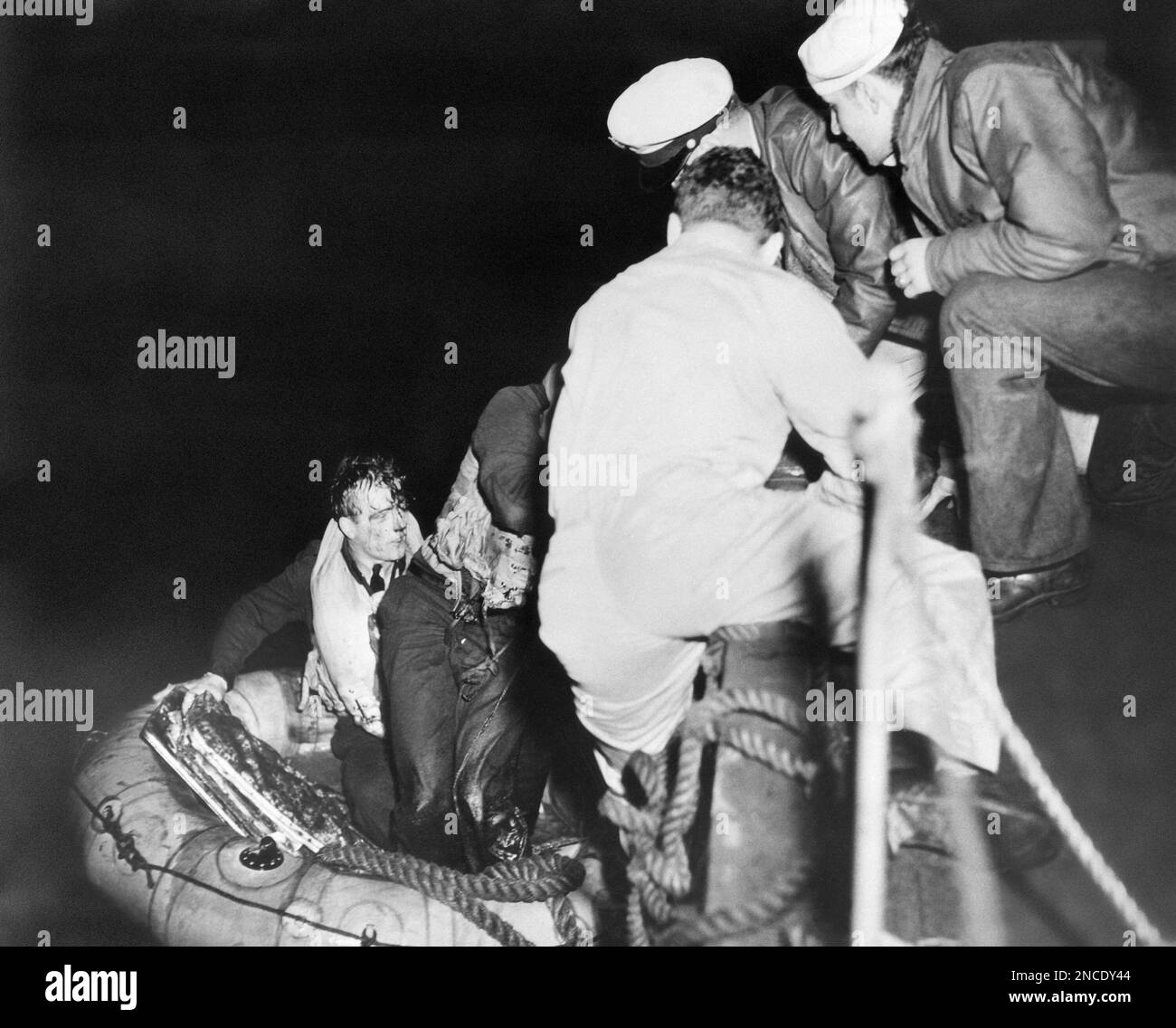 Two Allied fliers are helped aboard a U.S. Coast Guard rescue cutter ...