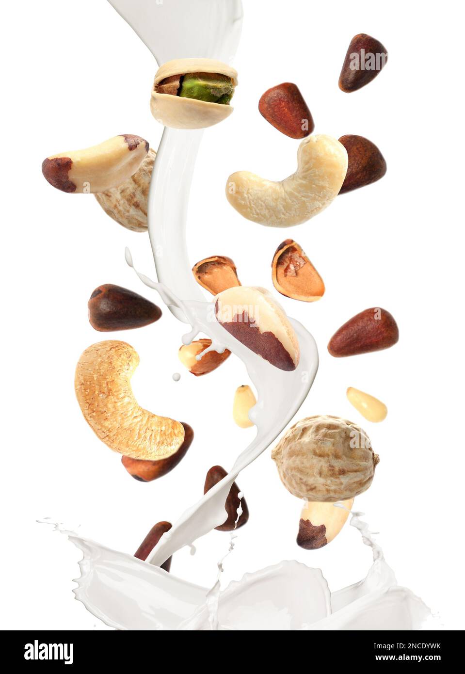 Delicious natural nut milk on white background Stock Photo - Alamy