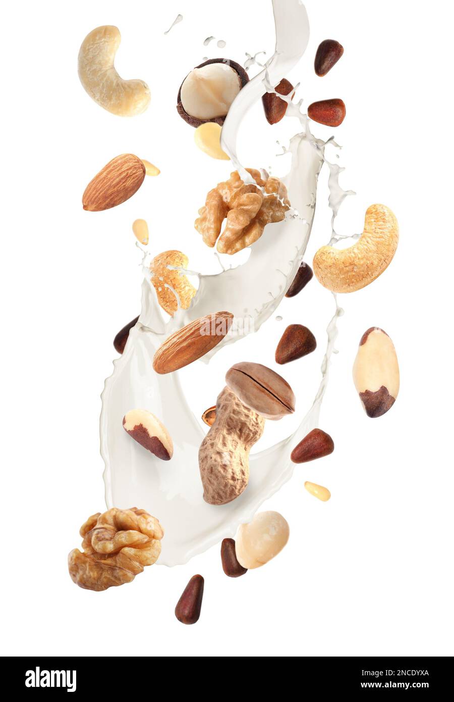 Delicious natural nut milk on white background Stock Photo - Alamy
