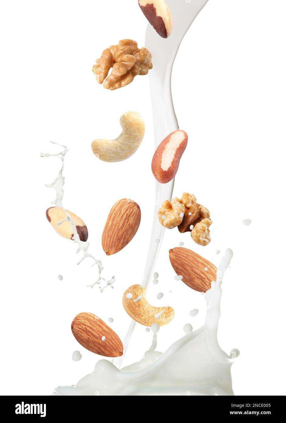 Delicious natural nut milk on white background Stock Photo - Alamy