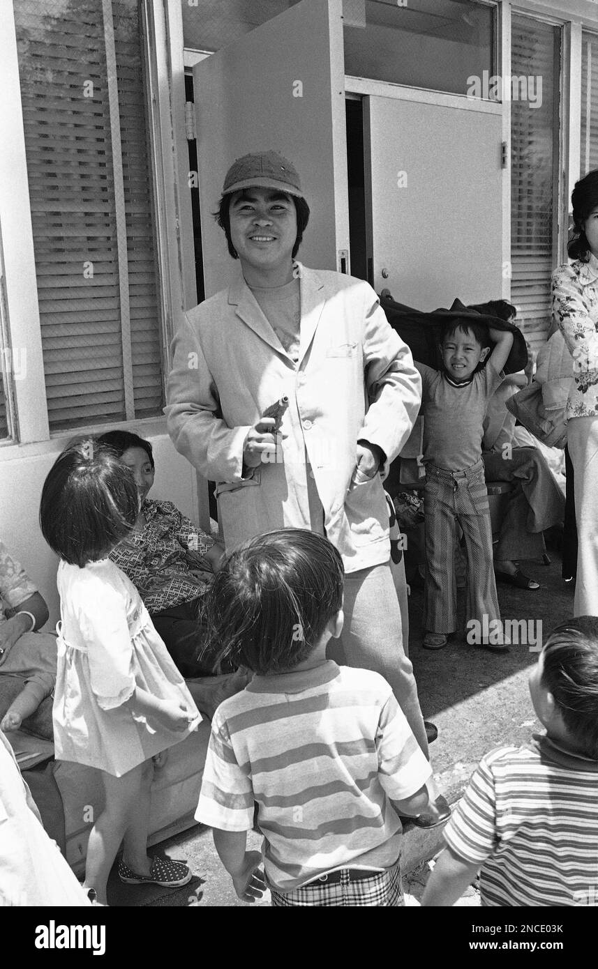 AP photographer Nick Ut poses with South Vietnamese refugees at Tent ...