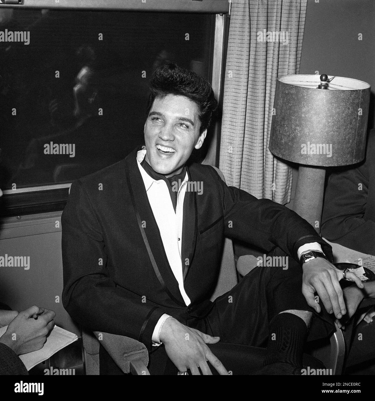 Singer Elvis Presley smiles during a press conference inside his ...