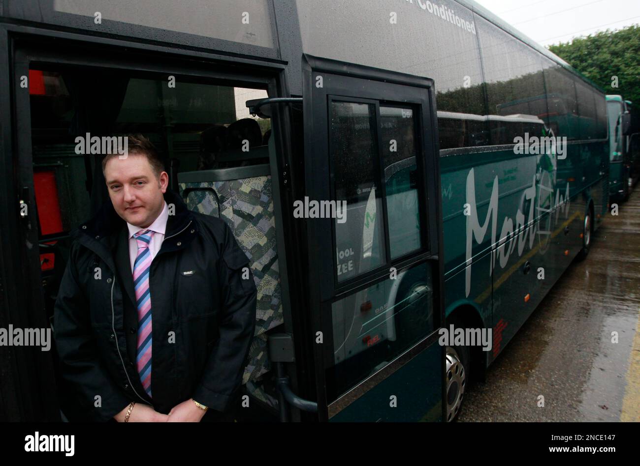Adrian Morton, the owner of Mortons Travel, poses by one of his coaches ...
