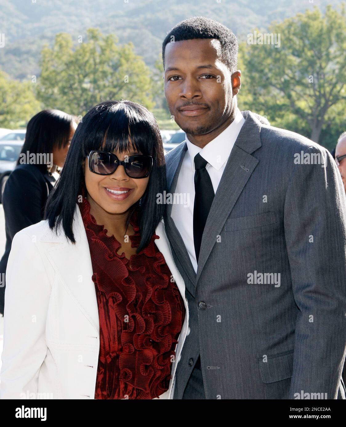 Flex Alexander and his wife Shanice Wilson arrive at a memorial service ...