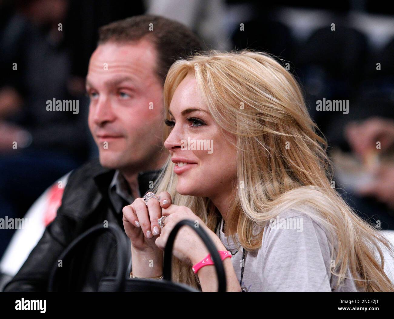 Pascal Mouawad, left, attends the Lakers game courtside with Lindsay ...