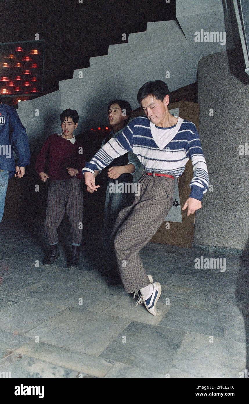 A Mongolian teenager displays his best Michael Jackson type dance moves ...