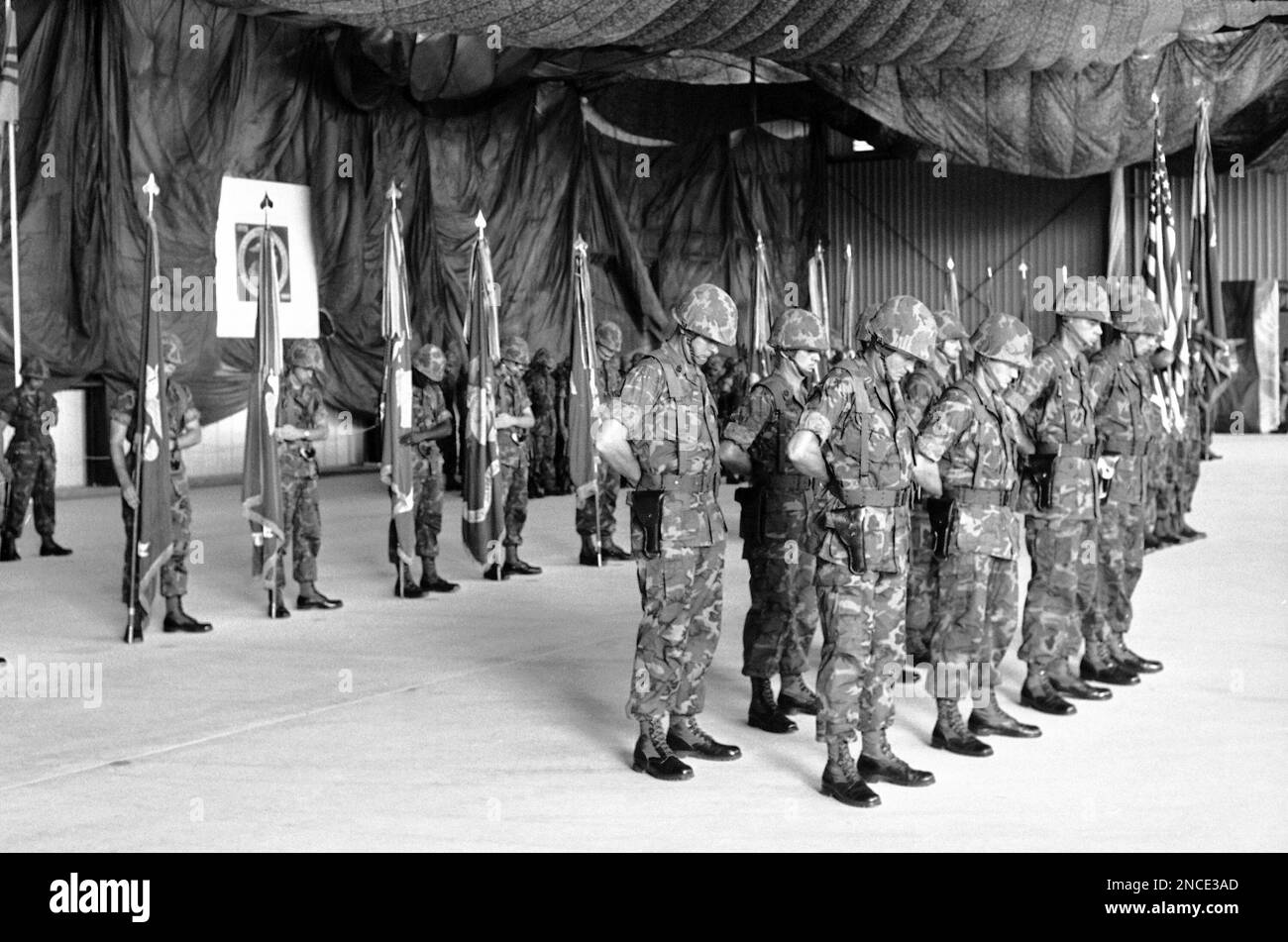 Members of the Third U.S. Marine Division guard of honor bow their ...